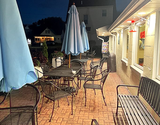 As evening falls, the patio transforms into an intimate gathering spot where summer nights stretch deliciously longer. 