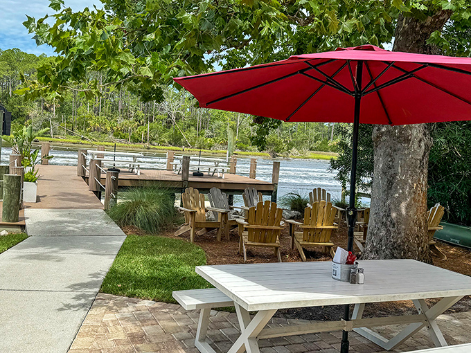 The outdoor seating area &ndash; where Adirondack chairs, waterfront views, and Florida sunshine create the perfect pre-dinner waiting spot.