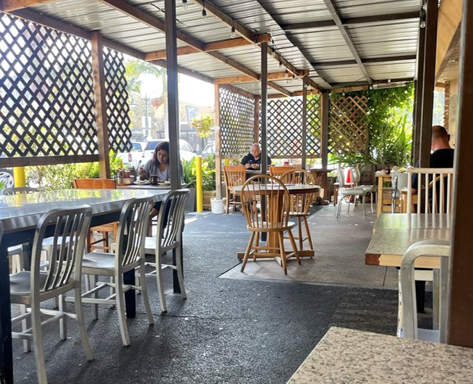 The covered patio where locals solve world problems over bottomless coffee and honest food.
