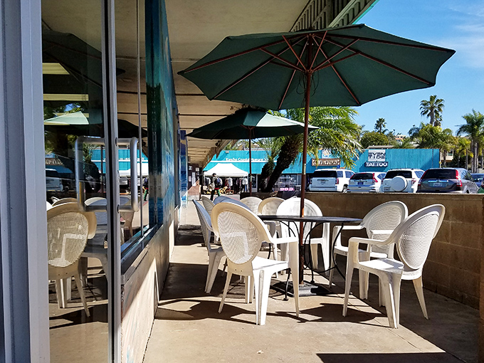 Outdoor seating with umbrella shade&mdash;because eating donuts al fresco makes them practically health food, right?