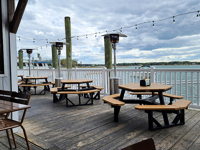 Outdoor seating with string lights and water views – Mother Nature's dining room with the added bonus of heaters for chilly evenings.