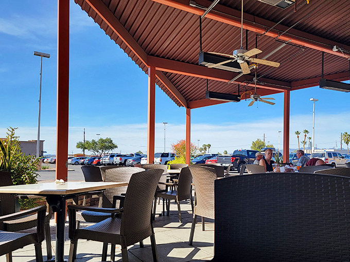 The outdoor seating area offers Tucson's famous blue skies as a side dish. Desert dining with ceiling fans&mdash;Arizona's version of climate control.