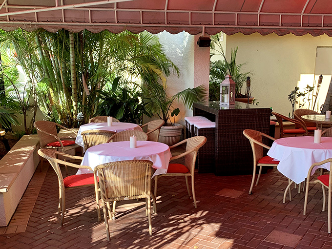 An outdoor patio offering al fresco dining under Florida's perpetual sunshine &ndash; because great steaks taste better outdoors.