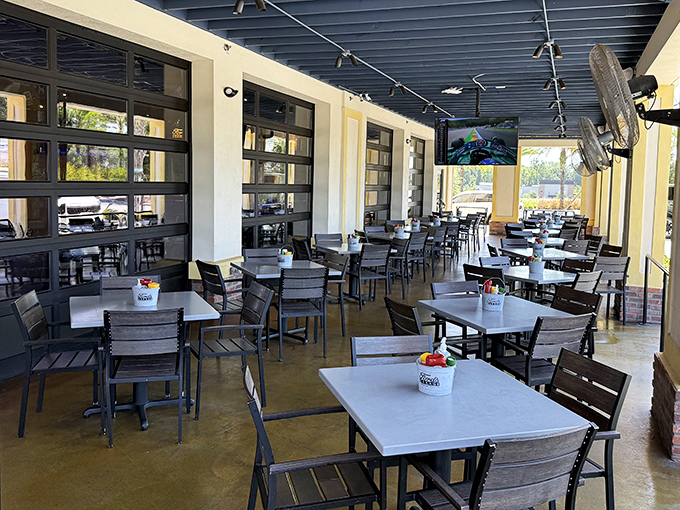 Florida's perfect weather deserves perfect outdoor seating. This garage-door patio blends the boundaries between inside and outside dining.