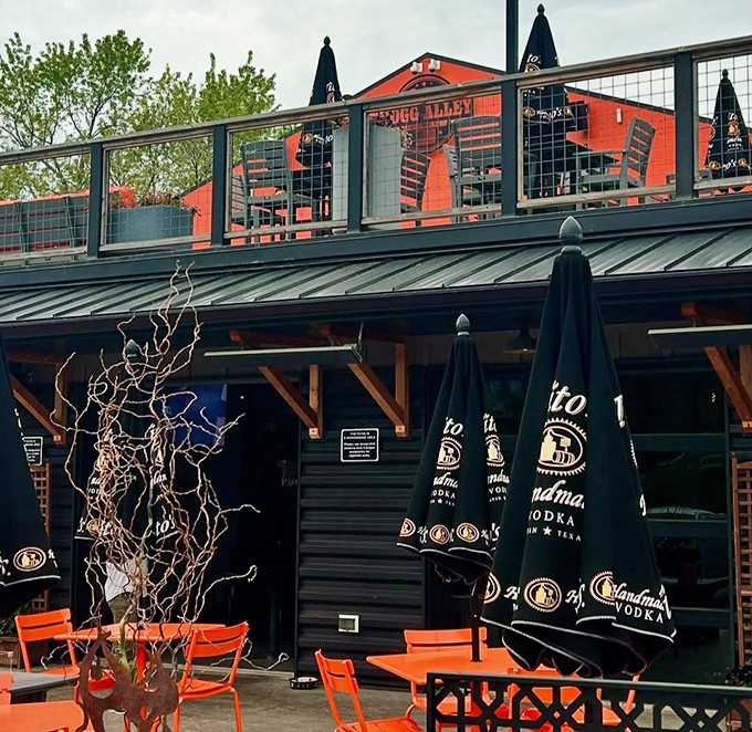 Summer in Wisconsin, distilled: a rooftop deck with orange chairs that pop against the sky. Lake country dining at its most inviting.