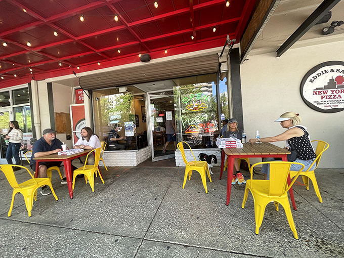 Cheerful yellow chairs outside invite you to enjoy your slice al fresco &ndash; pizza always tastes better with a side of people-watching.