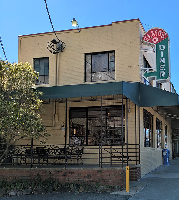 The corner spot with outdoor seating beckons passersby with a simple promise: life-changing comfort food awaits just beyond these doors.