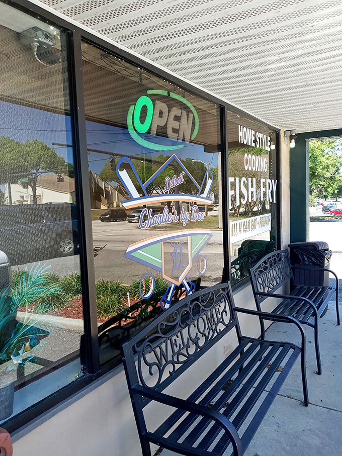 The welcoming "OPEN" sign and wrought iron benches invite you to take a moment before diving into breakfast bliss.