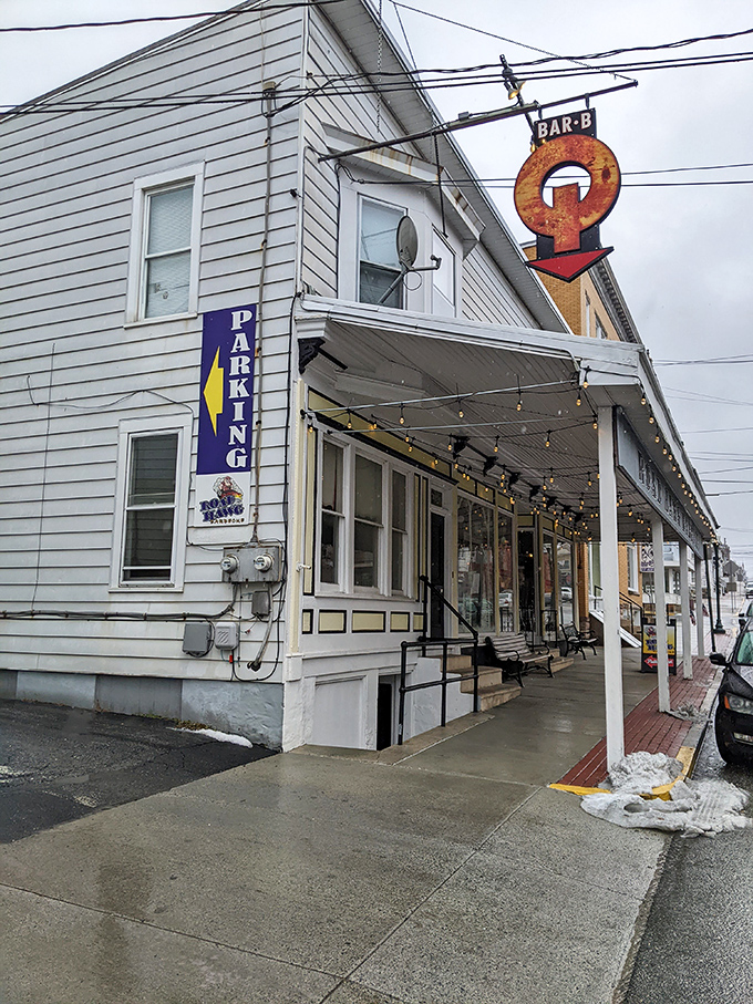 Even on a gray day, that vintage "BAR-B-Q" sign serves as a beacon of hope for hungry travelers seeking smoky salvation.