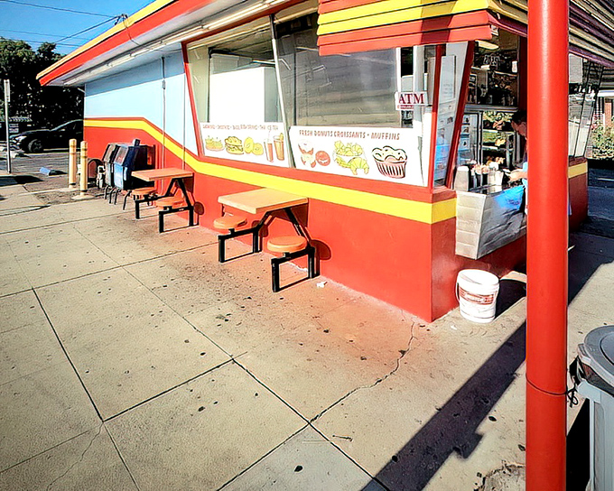 The exterior view shows Donut Hut in its natural habitat&mdash;a neighborhood institution that doesn't need to shout to be heard.