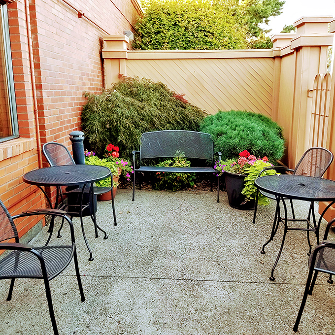 The courtyard offers a peaceful retreat for pre-dinner cocktails or post-steak recovery. Those flowers don't judge how many dinner rolls you devoured.