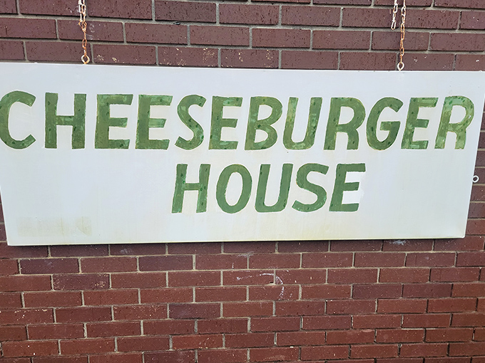 The sign doesn't need neon or flashing lights—when you're this good at burgers, simple green letters on white tell you all you need to know.