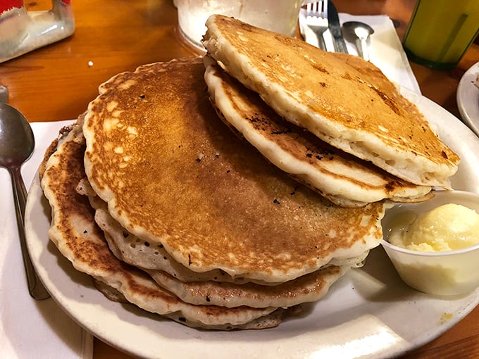 Pancake perfection that would make your grandmother both proud and a little jealous. Fluffy, golden, and stacked higher than your vacation expectations.