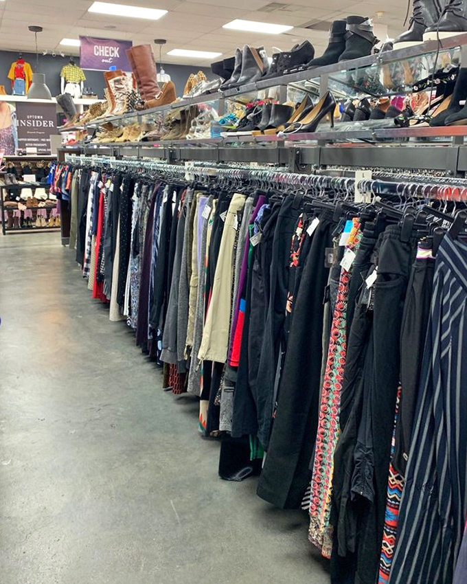 The pants section stretches as far as the eye can see, a denim ocean with occasional islands of colorful patterns.