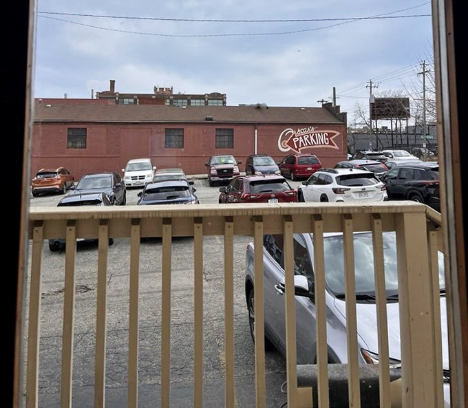 The parking lot view&mdash;where anticipation builds. Those cars aren't just parked; they're patiently waiting while their owners experience burger nirvana.