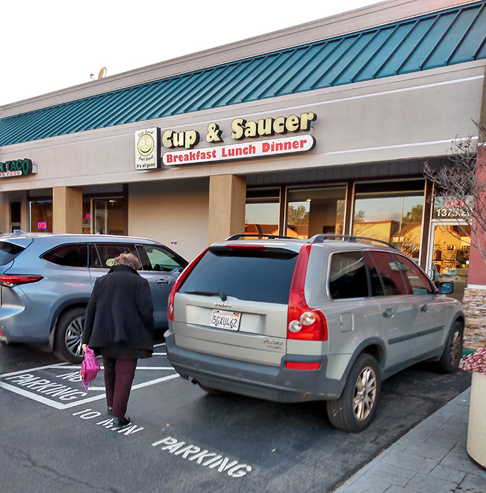 The parking lot pilgrimage that locals make regularly. That license plate has probably made this journey hundreds of times.