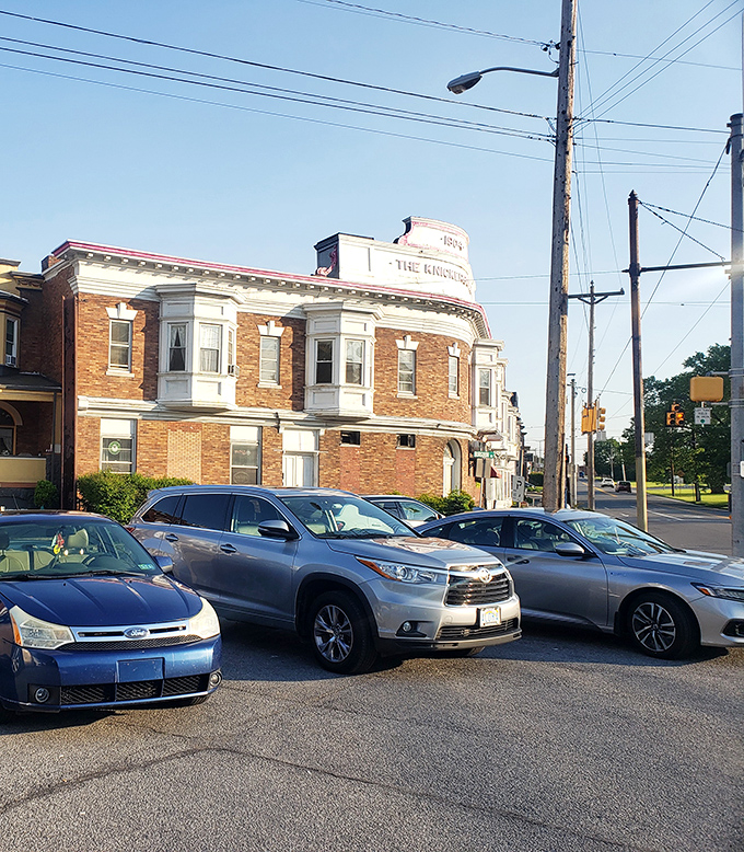 Even the parking area offers a view of the distinctive architecture, where the "1904" proudly announces over a century of serving the community.