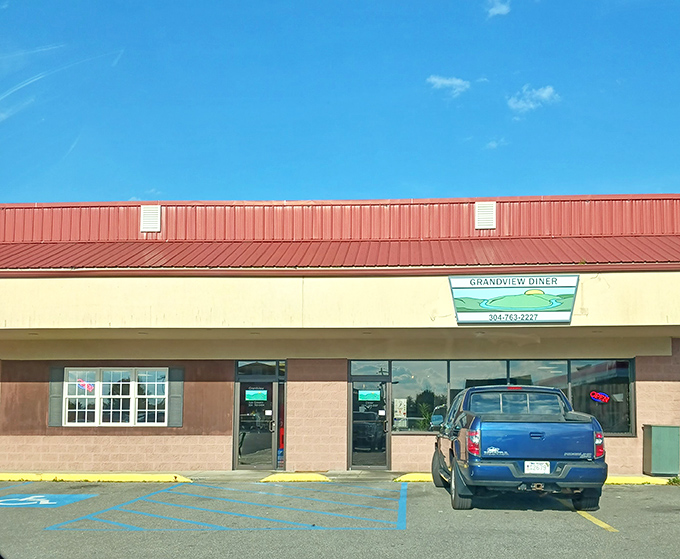 The parking area where vehicles wait patiently while their owners experience food euphoria inside. Cars have never been more jealous of their drivers.