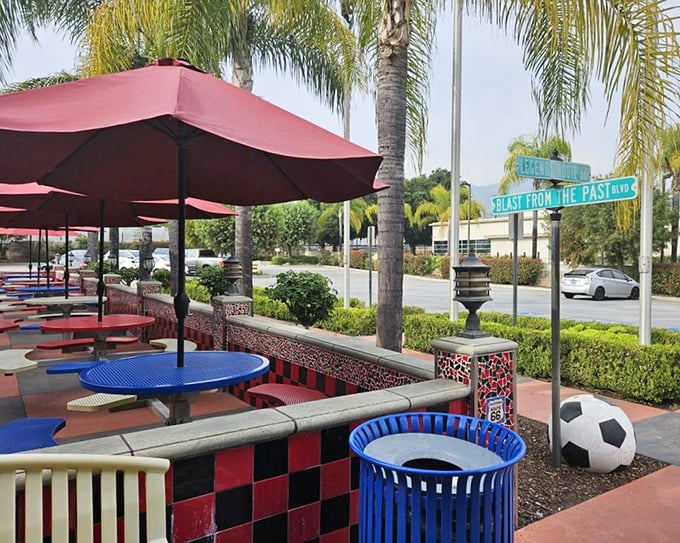 The outdoor patio offers a splash of California sunshine with its colorful tables and umbrellas—diner comfort with fresh air on the side.