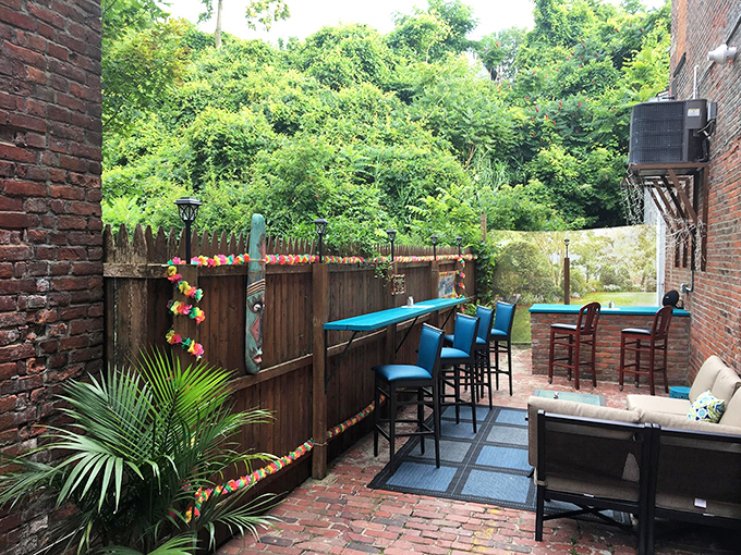 The charming patio offers a tropical oasis in unexpected Ohio, complete with tiki-inspired touches and lush greenery that begs for summer evening gatherings.