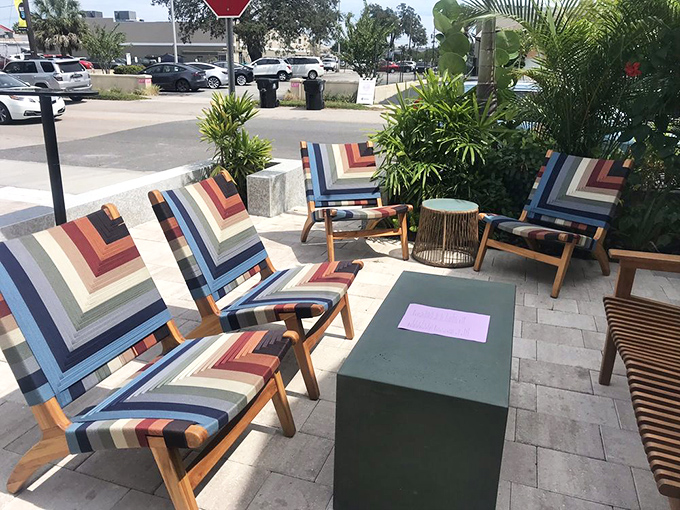 "Colorful chairs invite conversation on the patio – the perfect spot to debate which dish deserves a return visit (spoiler: it's all of them)."