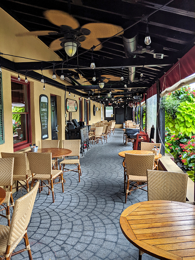 The covered patio offers al fresco dining without weather worries &ndash; string lights overhead turning ordinary evenings into something magical.