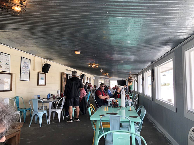 Waterfront dining where the entertainment includes real boats doing actual work, not theme park versions of maritime life.
