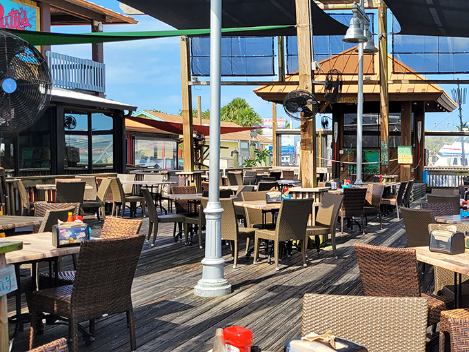 Outdoor seating that offers the quintessential Florida dining experience – fresh air, water views, and the promise of seafood that was swimming this morning.