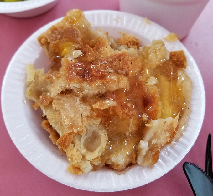 Peach cobbler that doesn't need to show off – warm, sweet, and honest dessert that closes the BBQ symphony with a perfect final note.