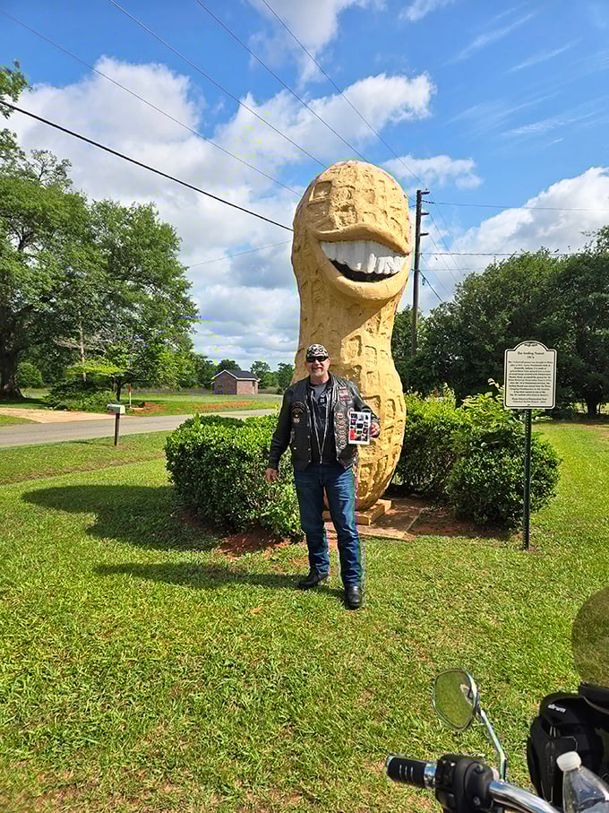 Another satisfied visitor documenting his encounter with peanut royalty. This photo will definitely be the highlight of his travel album.