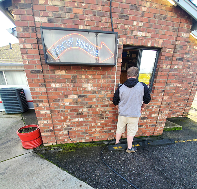 The pickup window: where hungry drivers make a quick pit stop for burger bliss without leaving their vehicle's embrace.