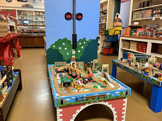 The gift shop's miniature train table delights young engineers-in-training, proving that railroad fascination spans generations despite our digital age.