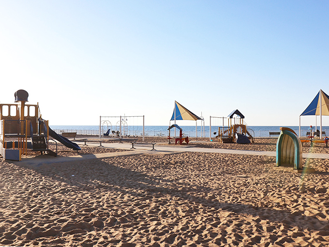 Childhood joy meets lakefront views at this sandy playground paradise. Where kids build memories against the backdrop of endless blue, and parents secretly wish they could join in.
