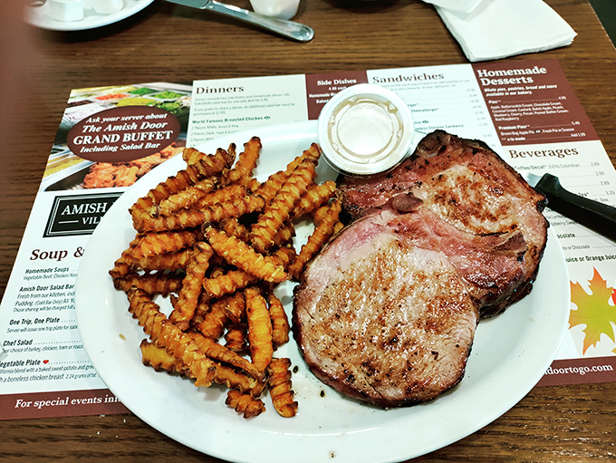 A pork chop and crinkle fries that would make a vegetarian question their life choices. That meat isn't just cooked&mdash;it's been persuaded to perfection.