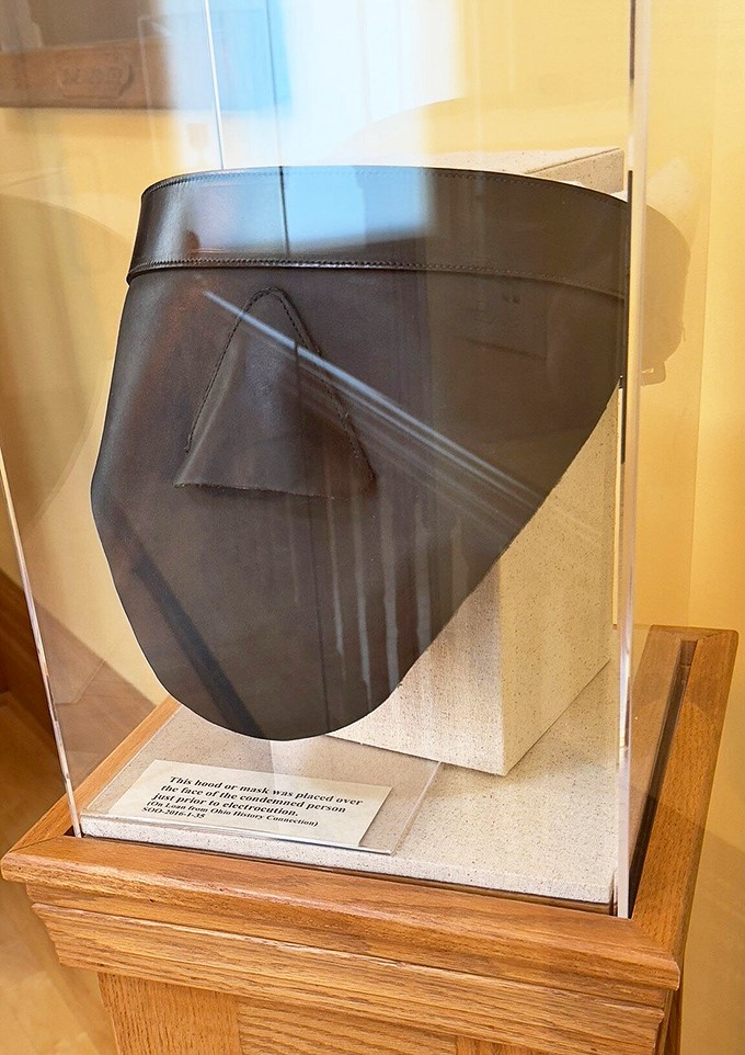 Before lethal injection came this grim hood. The execution mask represents the reformatory's darkest purpose, displayed now as a somber historical artifact.