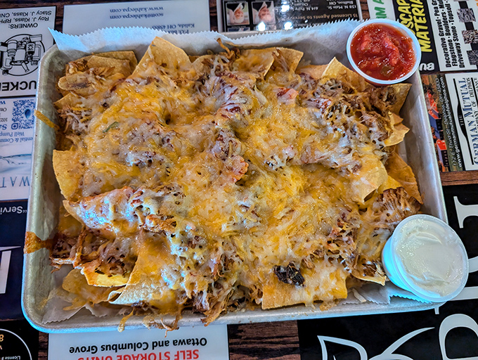 Nachos that require a strategy to eat and a moment of silence to appreciate. The pulled pork didn't sacrifice itself in vain.