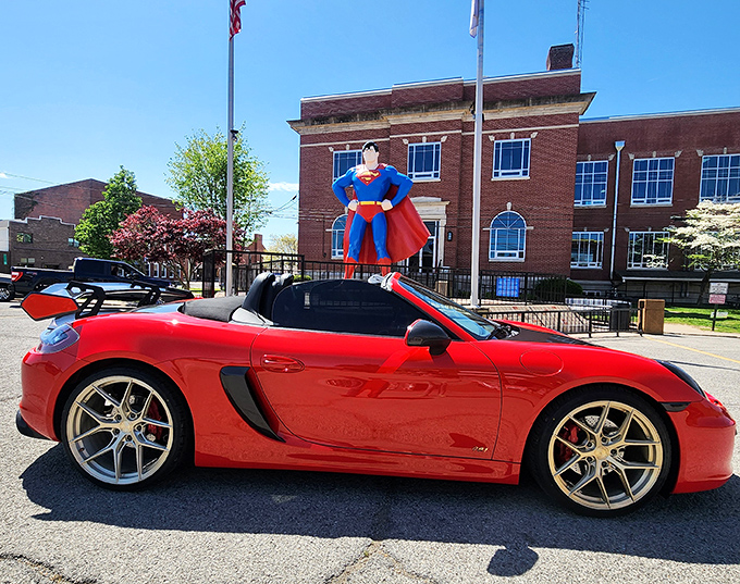 Some visitors coordinate their vehicles with Superman's color scheme&mdash;this red sports car owner clearly understood the assignment.