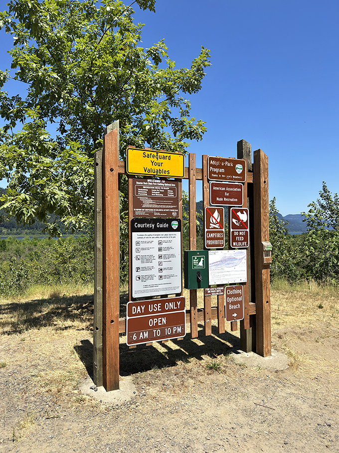 The sign says it all: day use only, clothing optional beach, and no campfires. The fine print of paradise requires some reading.