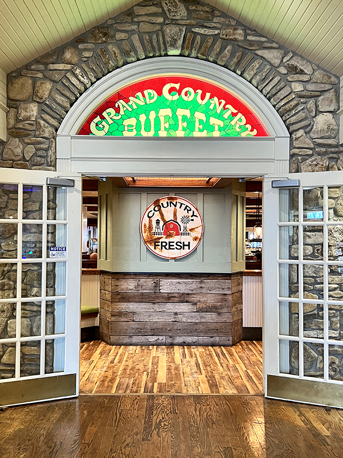 The stone archway entrance with its illuminated sign doesn't just say "welcome"&mdash;it practically whispers "come on in, the biscuits and gravy are waiting."