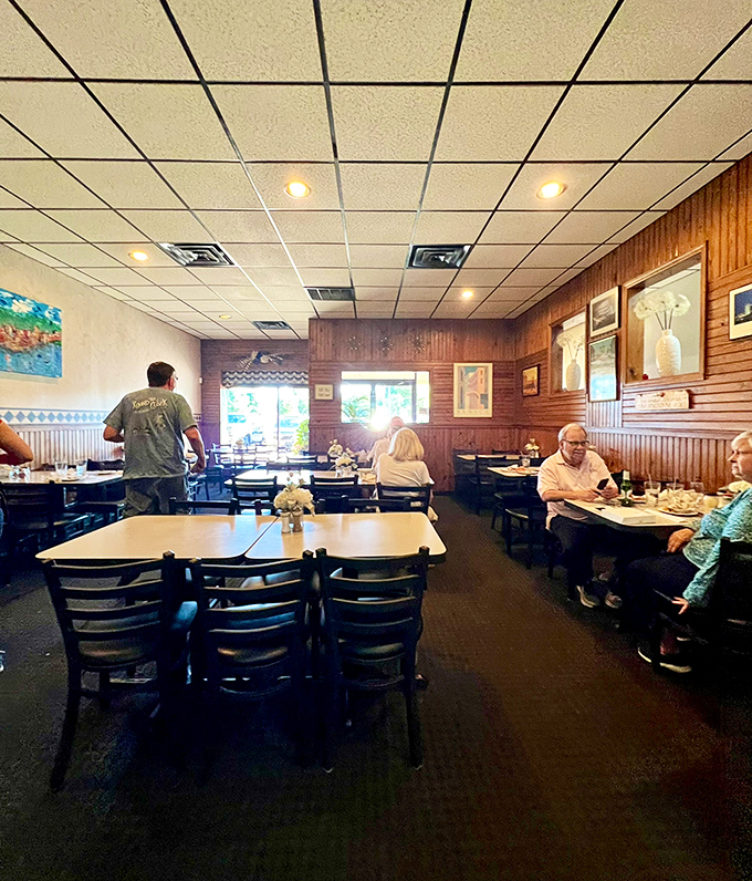 The restaurant's interior says, "We spent our money on ingredients, not decorating." The diners' satisfied expressions say that was exactly the right decision.