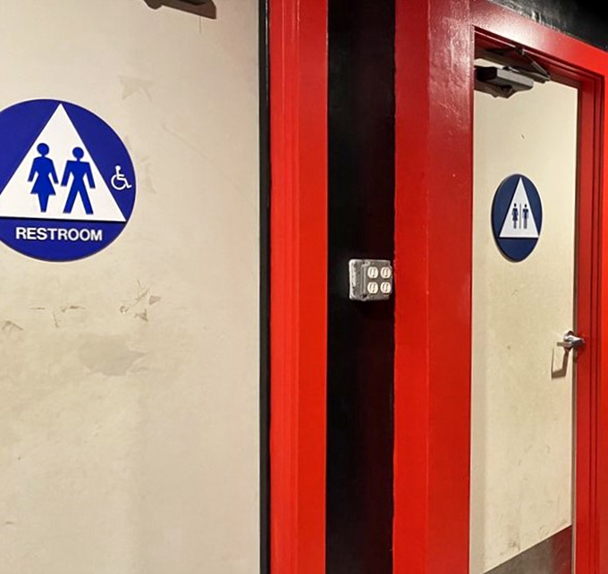 Even the restroom signs maintain the no-frills approach. In a place this authentic, even bathroom breaks are straightforward affairs.