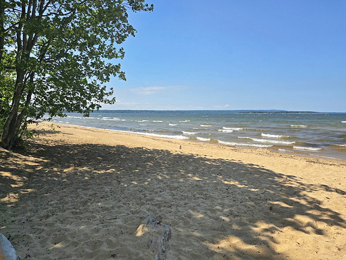 Superior's gentle waves create nature's own lullaby along Brimley's sun-dappled shore.