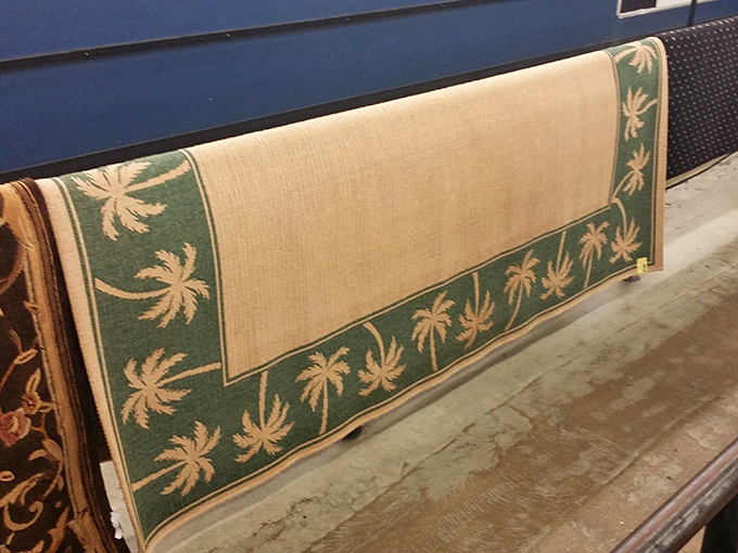 Florida meets function&mdash;a palm-bordered rug that once tied someone's room together now waits for its next supporting role.