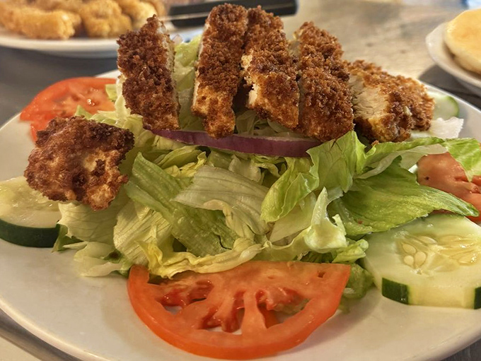 Even the salads come with a Keys attitude—crispy chicken perched atop fresh veggies like it's claiming new territory.
