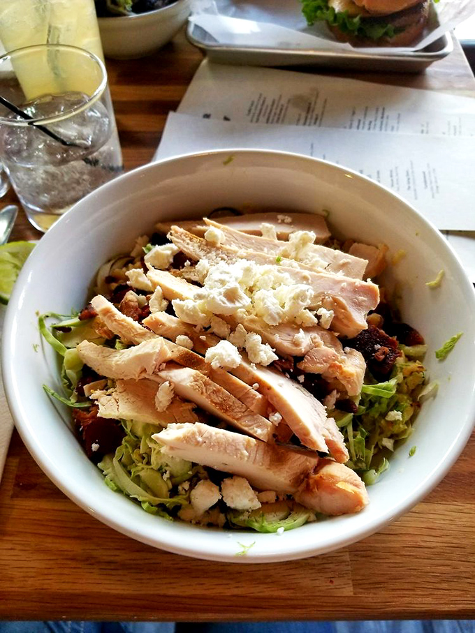 A salad that doesn't apologize for being healthy—it's too busy being delicious with fresh greens, protein, and enough cheese to make vegetables exciting.