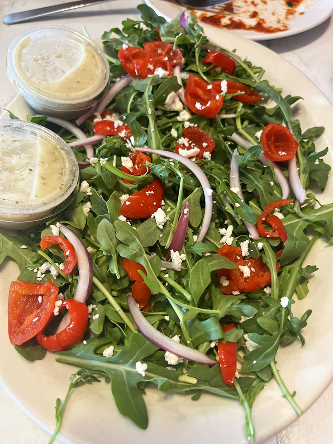 A salad that actually looks like something you'd want to eat&mdash;peppery arugula, sweet roasted peppers, and feta that adds the perfect salty punch.