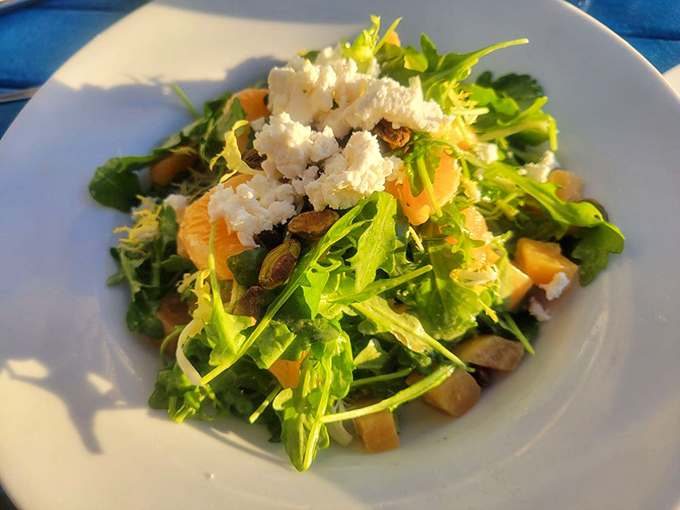 A salad that doesn't apologize for being healthy. Bright greens, citrus, and cheese create a refreshing counterpoint to richer seafood dishes.