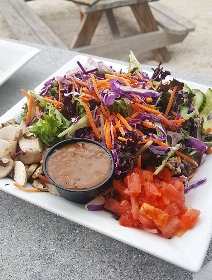 A salad that doesn't apologize for being healthy&mdash;vibrant, crisp, and colorful enough to make you temporarily forget about the fried options you almost ordered.