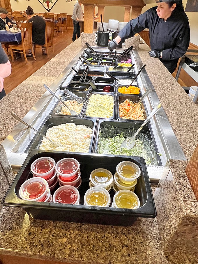 The salad bar stretches like a runway of freshness, though calling it a "salad" bar seems unfair to the wealth of options beyond greens.