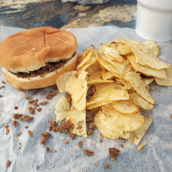Simplicity on wax paper: A perfectly proportioned sandwich with just enough chips to ensure no bite goes unaccompanied.